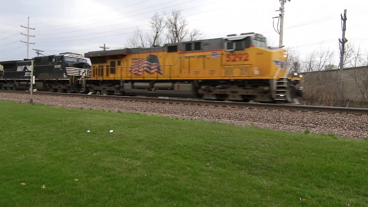 UP 5292 and NS 9555 lead a manifest east through Geneva IL - YouTube