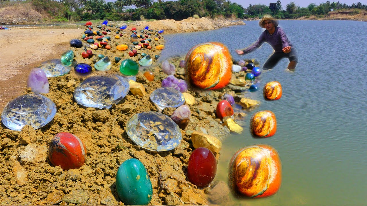 Gold hunters hunt for gems along the riverbank near the foot of the ...