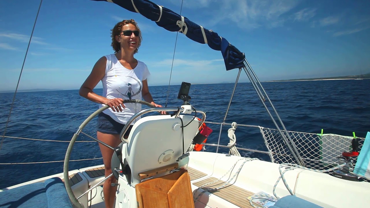 woman at wheel steering sailboat on adriatic sea in croatia - YouTube