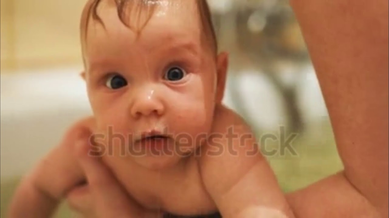 Newborn baby swimming bath bathtub help mother hands closeup portrait ...