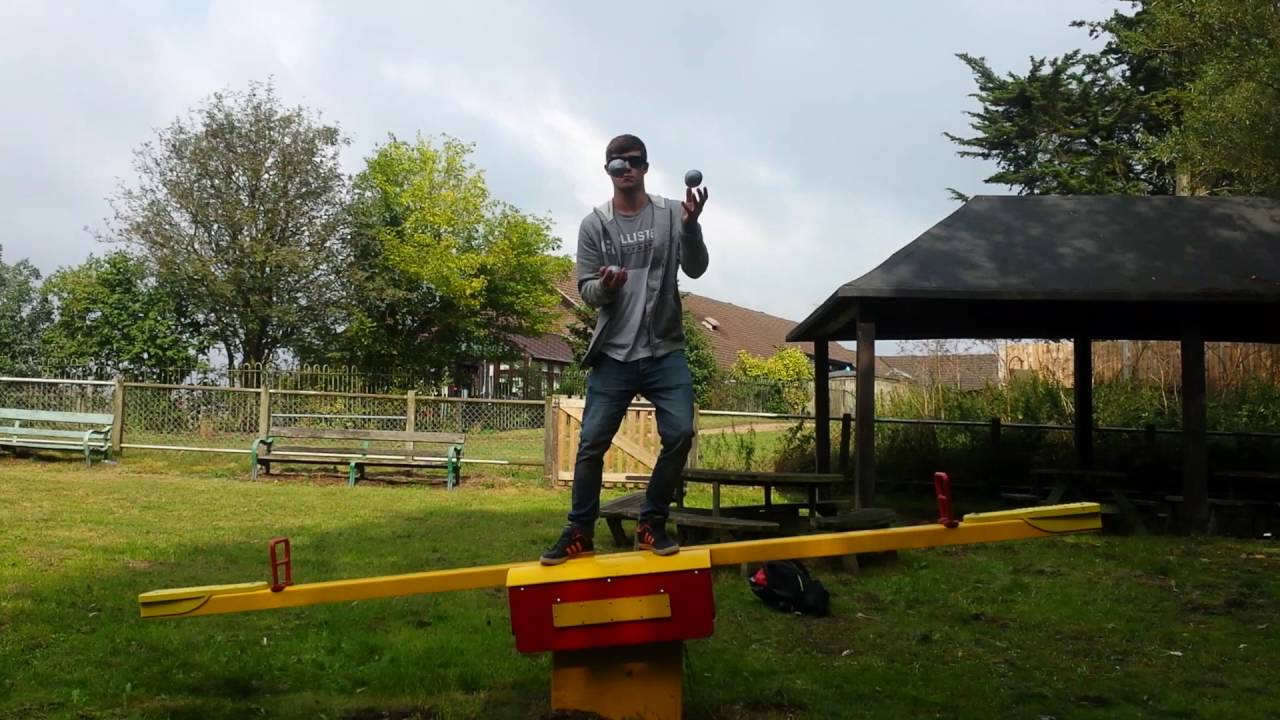 Josh juggling on the seesaw - YouTube