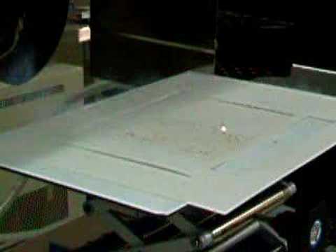 Laser cutting cardboard into a puzzle - YouTube