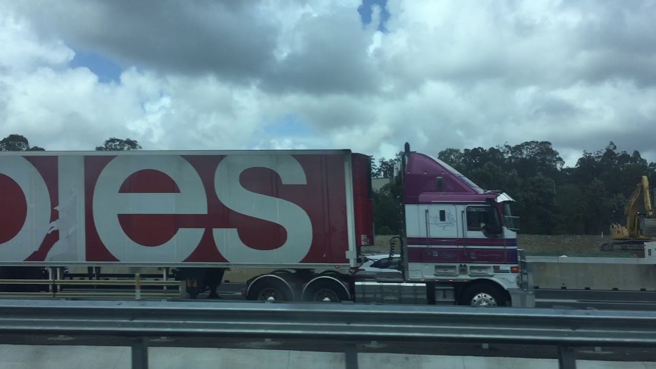 Coles Truck with a pink Kenworth + Dawson’s haulage truck on the ...
