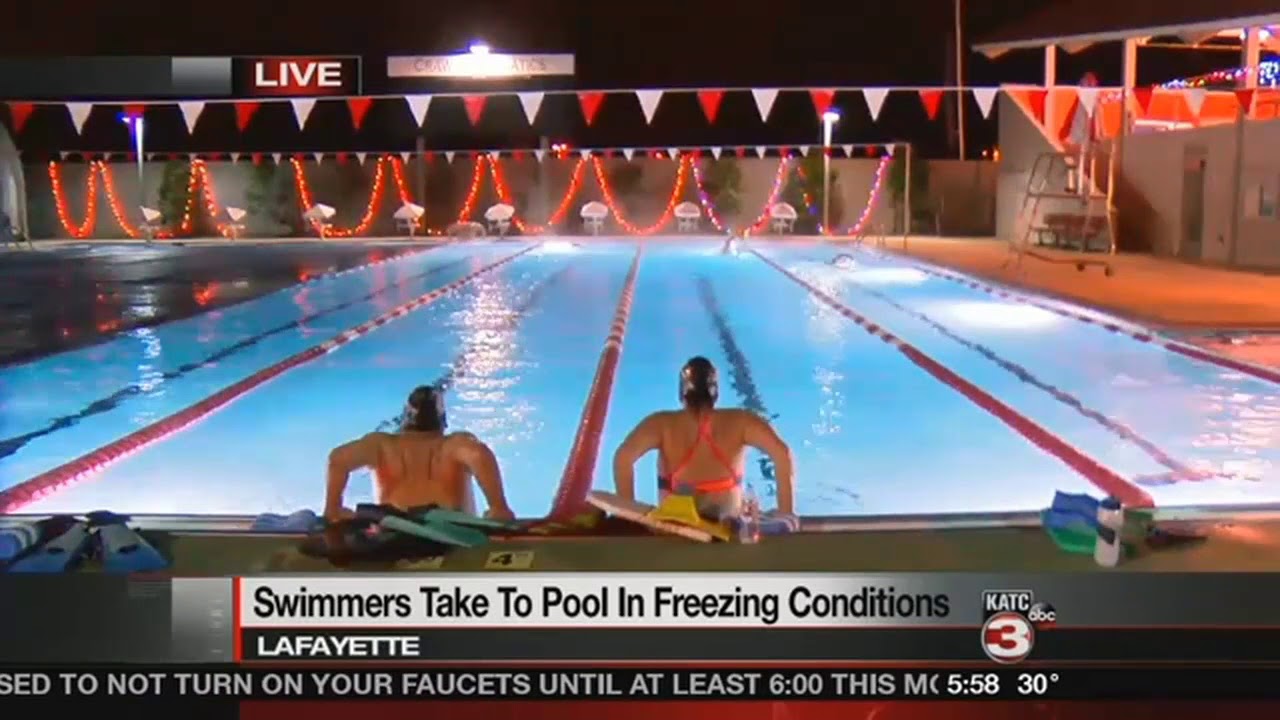 Swimmers at Crawfish Aquatics brave the temps for exercise - YouTube