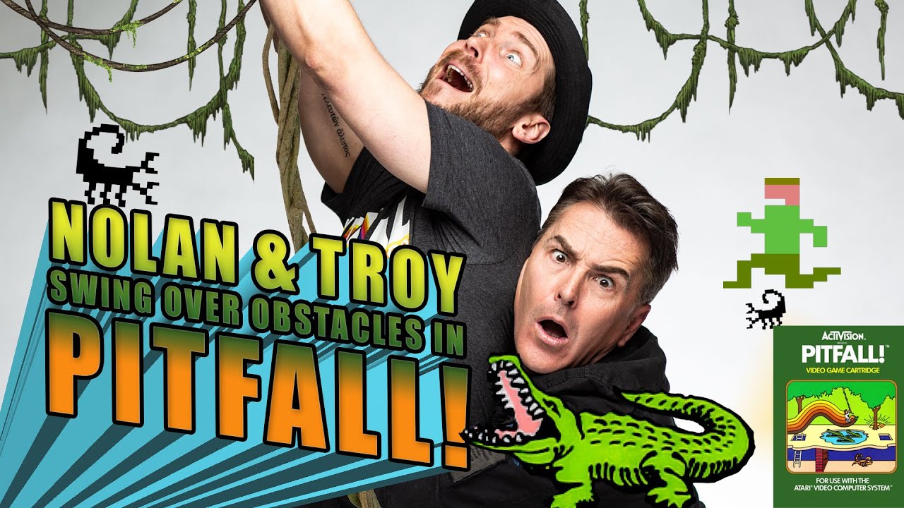 Nolan North and Troy Baker Swing Over Obstacles in Pitfall! - YouTube