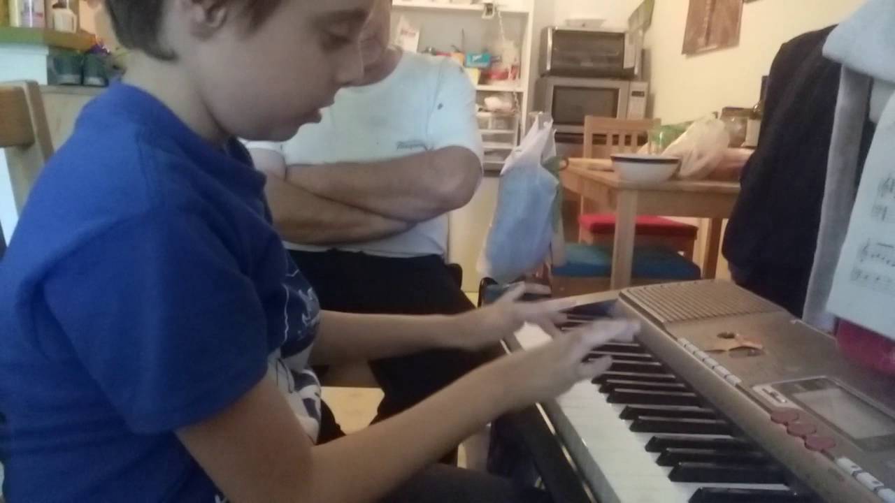 non verbal autistic child plays piano - YouTube