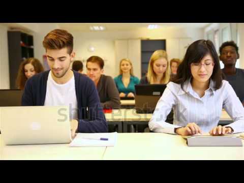 Students Typing On Tablet Computer And Laptop In A Classroom Full HD ...