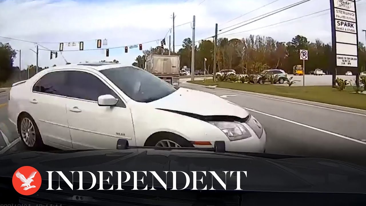 Moment stolen car smashes into police vehicle head-on - YouTube