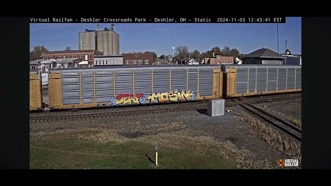 CPKC heritage unit leading CPKC intermodal autorack train at Deshler ...