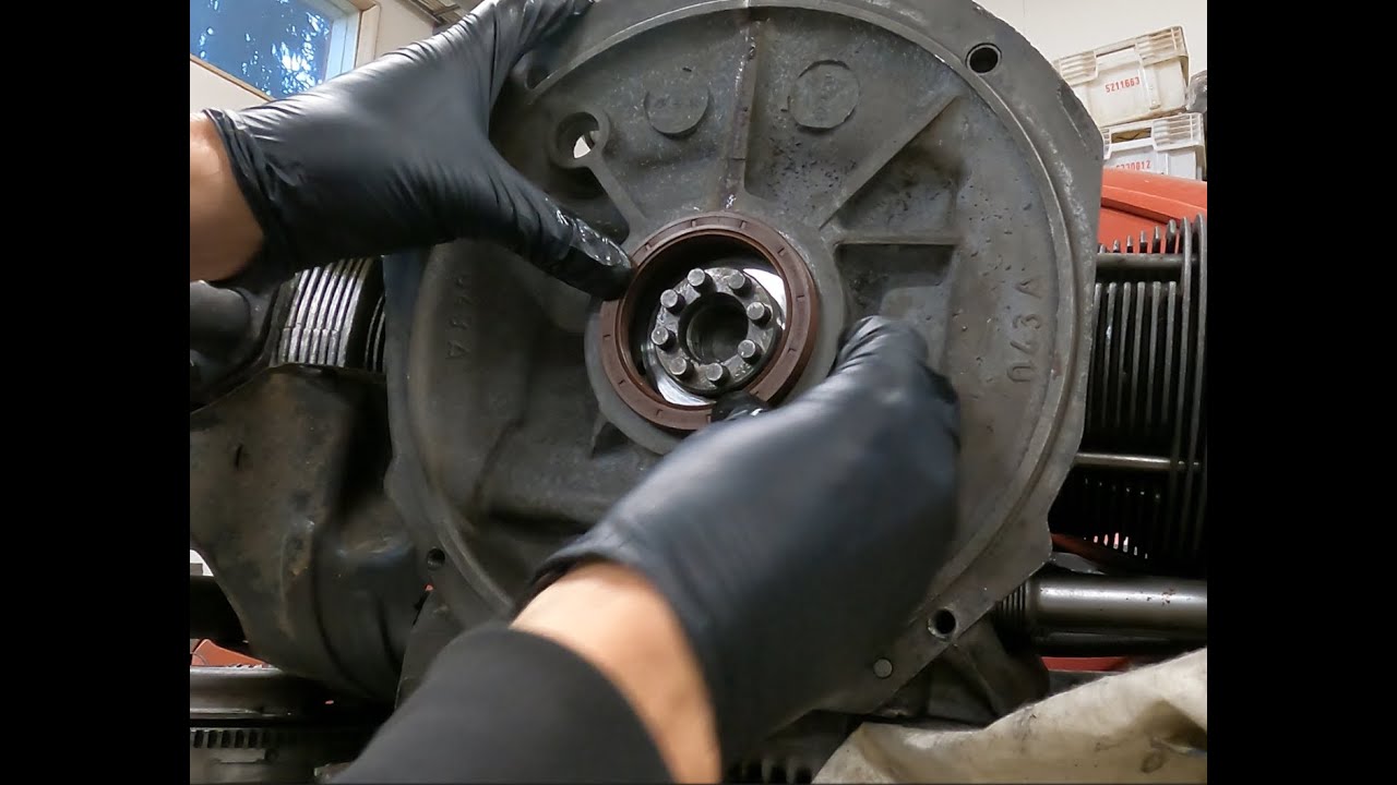 Replacing leaky main crank oil seal and installing flywheel and clutch ...