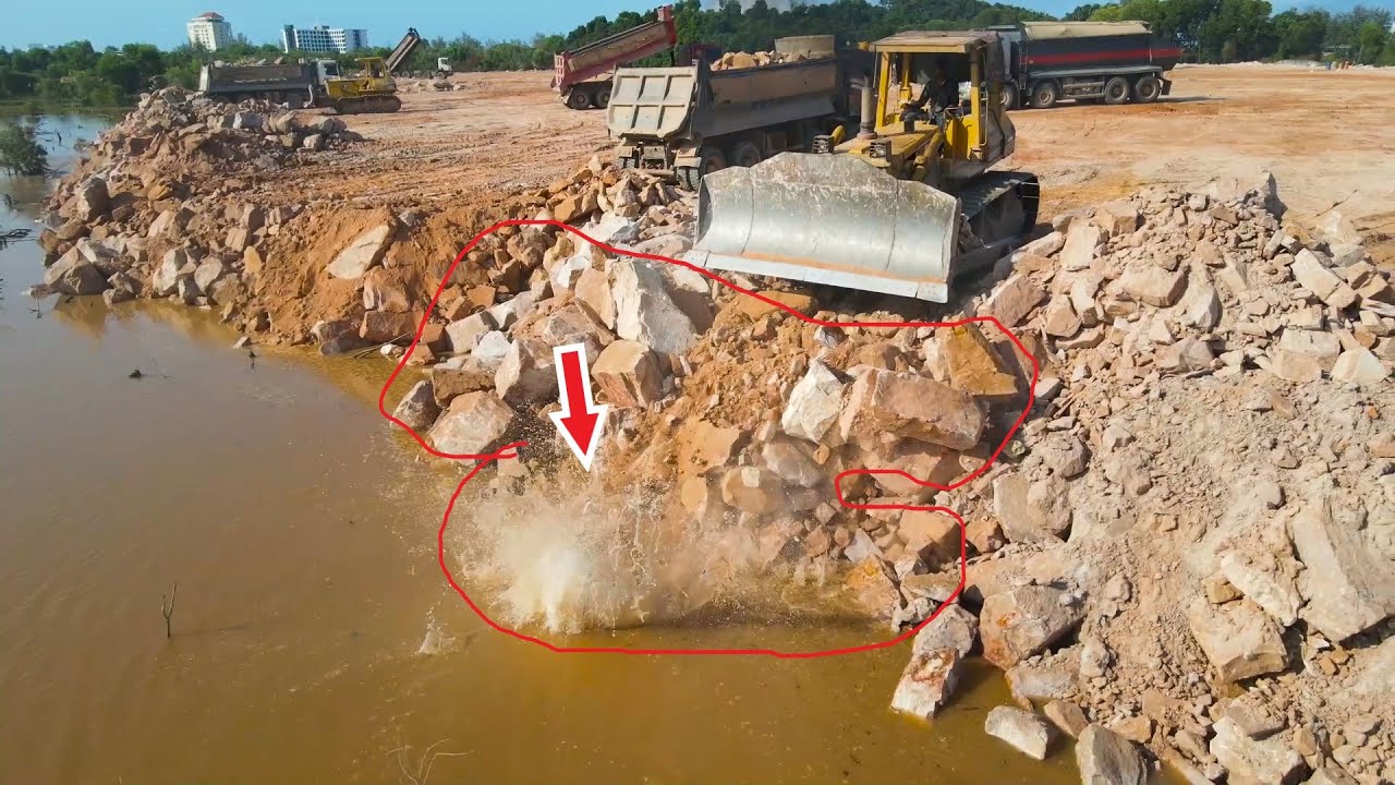 Awesome Power Mighty Machines Bulldozer Push Big Stone Sinking In Water ...