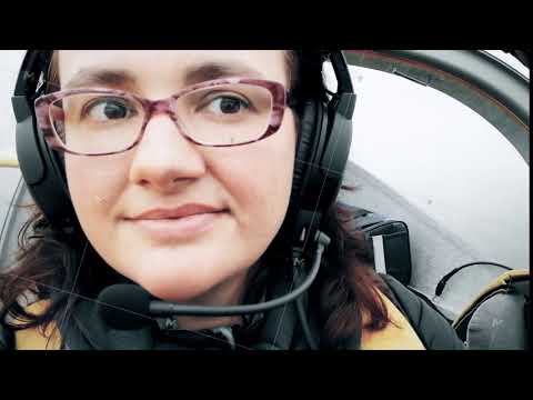 woman pilot flying plane, close up portrait, cute young happy smiling, hobby freedom concept sky