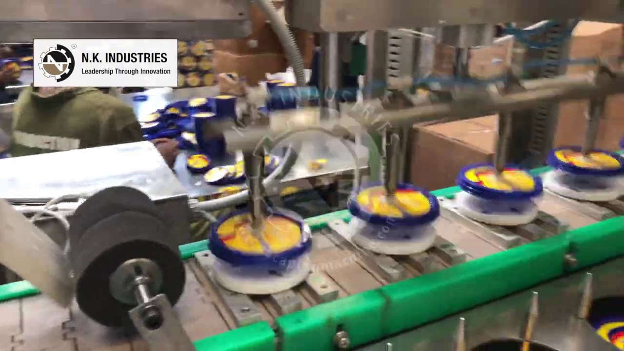 Lid Sticker Labeling Machine & Stacking Machine - YouTube
