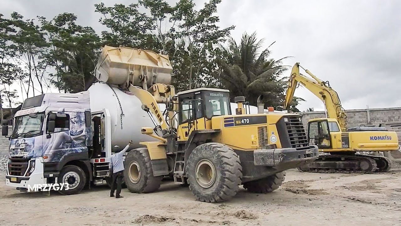 Excavator Wheel Loader And Quester Self Loader Truck Moving Silo - YouTube