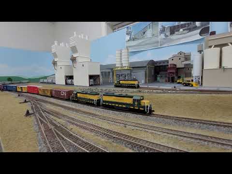 N scale Housatonic RR rolling by Specialty Minerals as it is being switched.