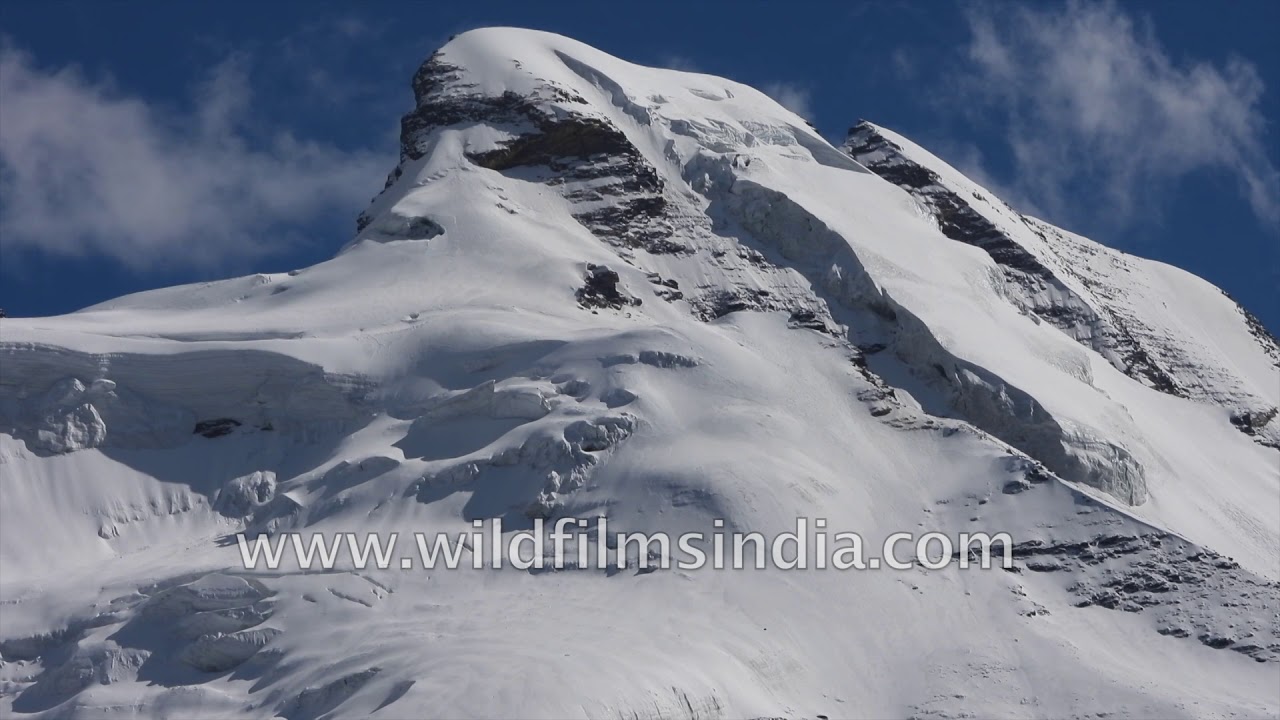 Snowed under heavily glaciated Himalayan peaks of Gangotri range in ...