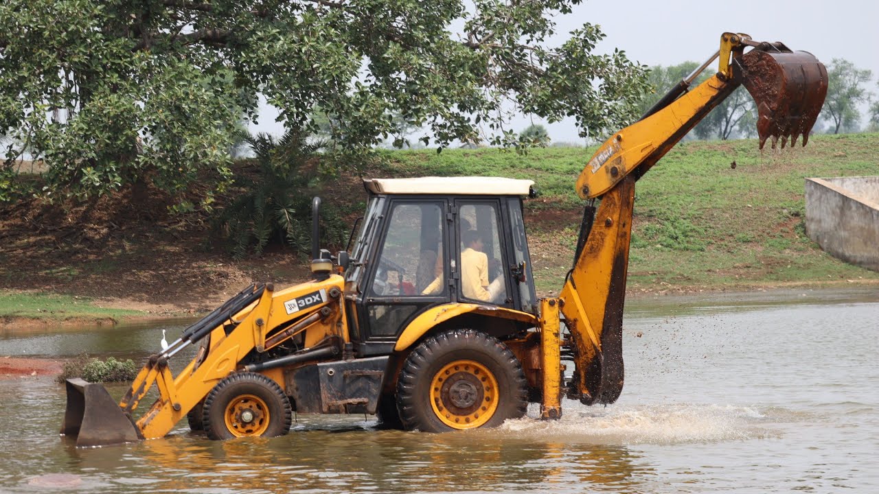 JCB BACKHOE WASHING IN VILLAGE PONDS - YouTube