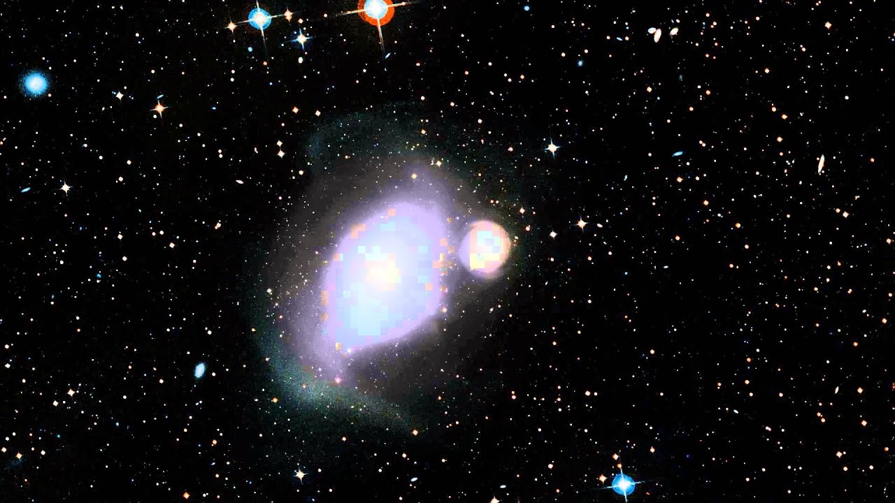 Zooming in on the galaxies NGC 1316 and 1317 - YouTube