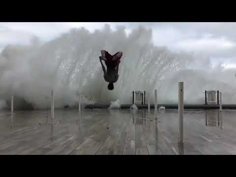 Guy Performs Backflip as Wave From Ocean Comes From Behind - 1129561 ...