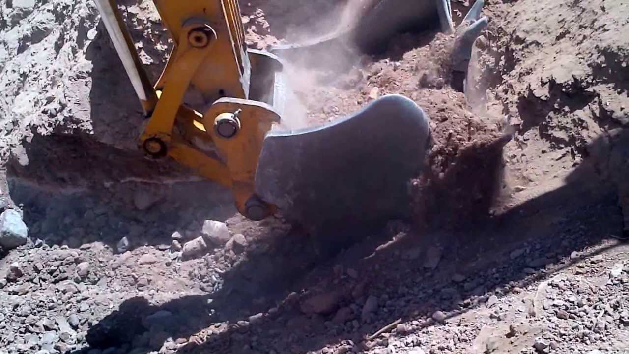Multi-Ripper Bucket excavating rock - YouTube