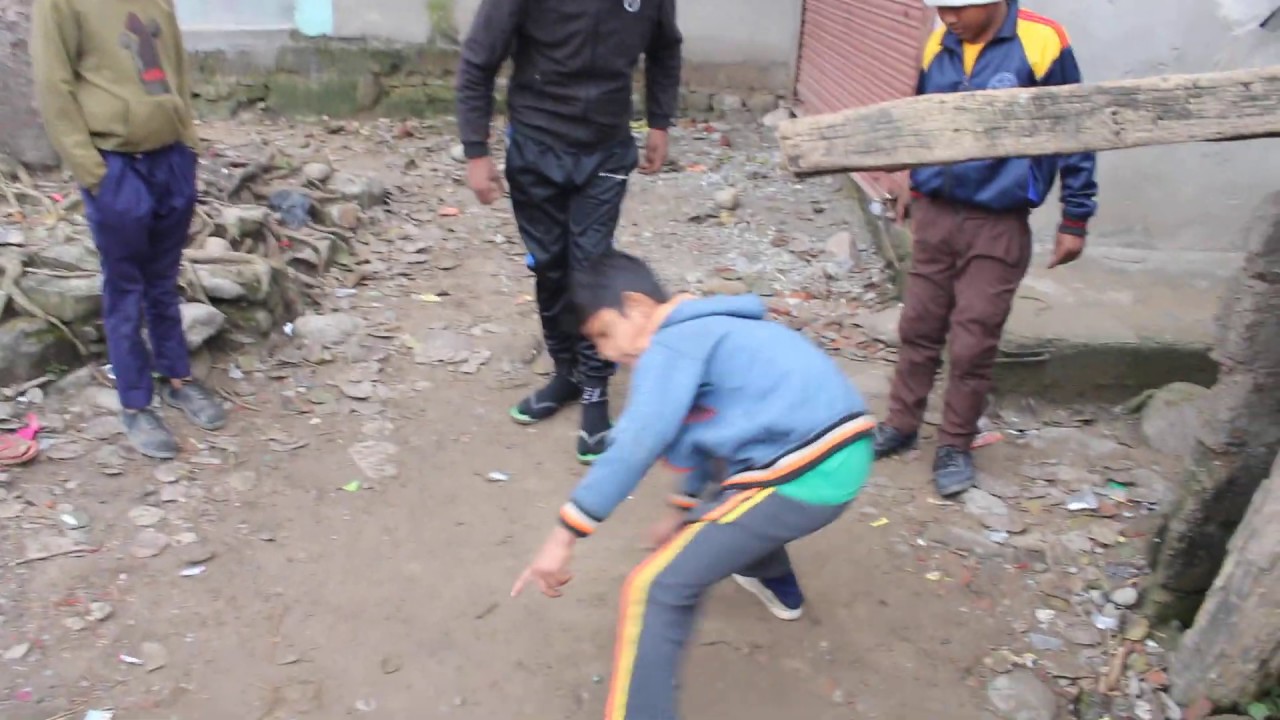 Nepali childhood Game || Guchcha (गुच्चा) || Local kids playing Marbles ...