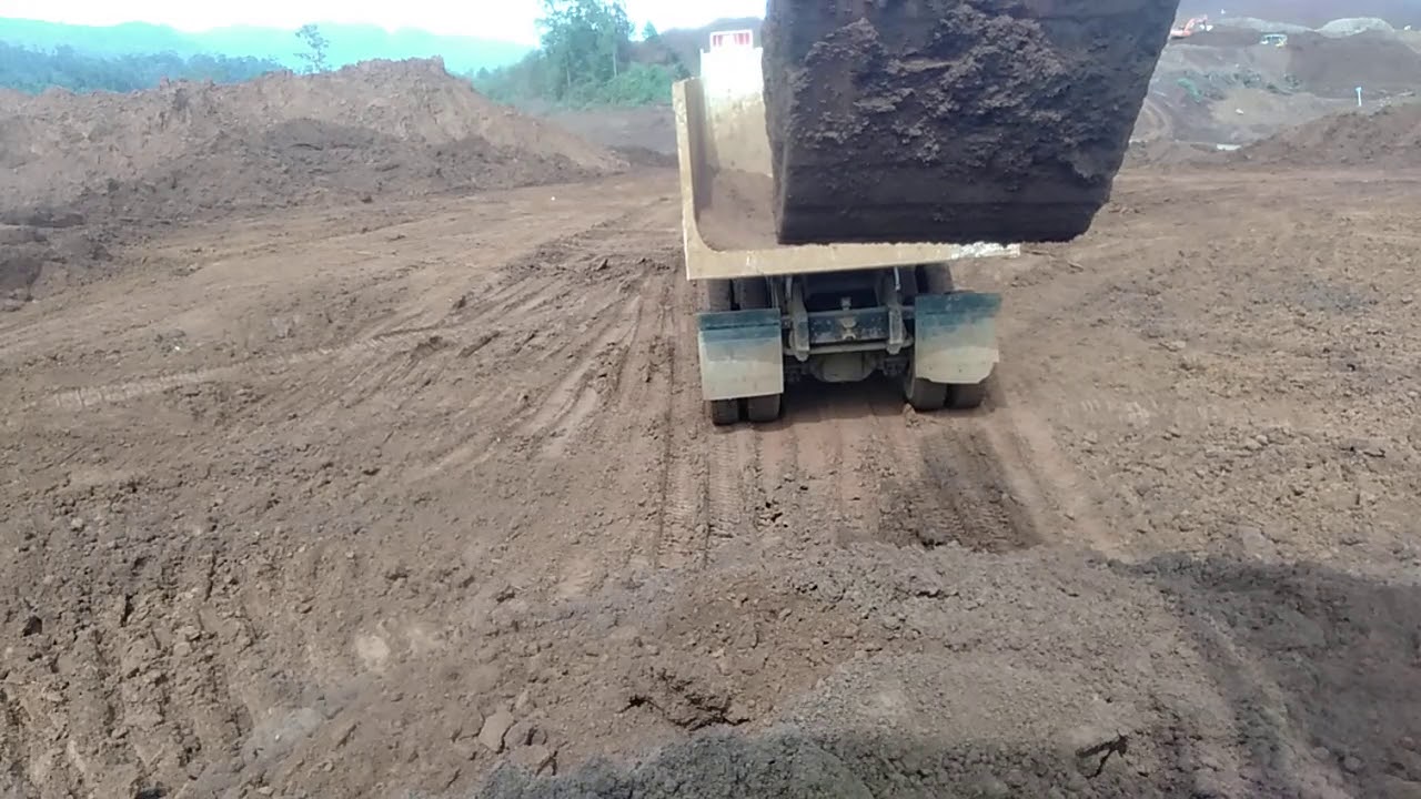 Loading OB. CAT 320 to IVECO nickel mining PT. Getsemani Indah site ...