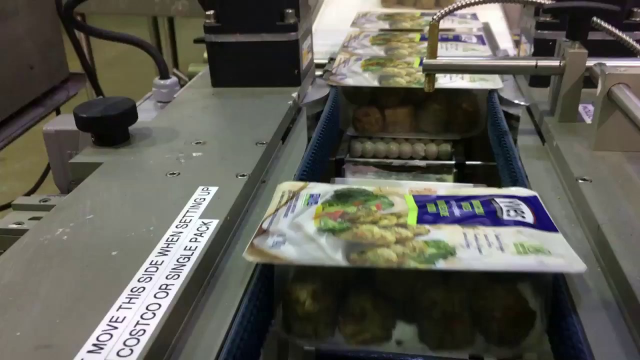 Packaging Division - Labeling and Lidding Film Application Machine ...
