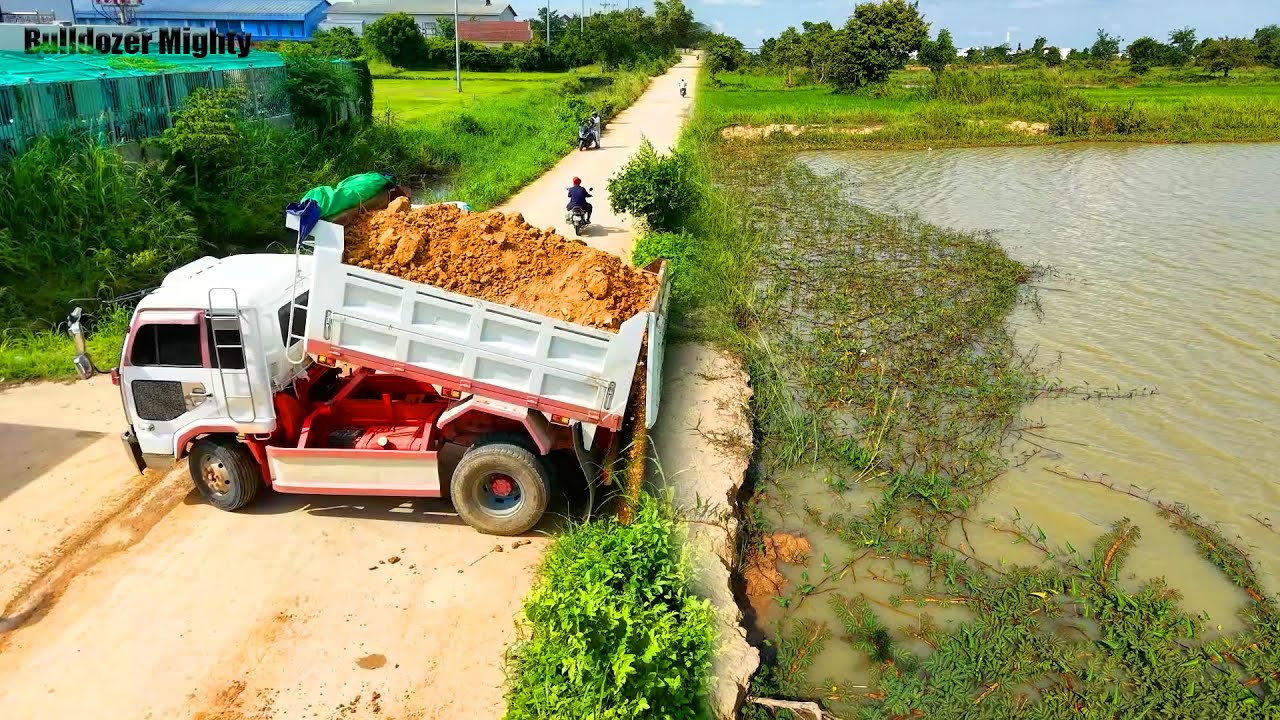 The First Dump Truck Unloading, Processing Filling Up The Land huge ...