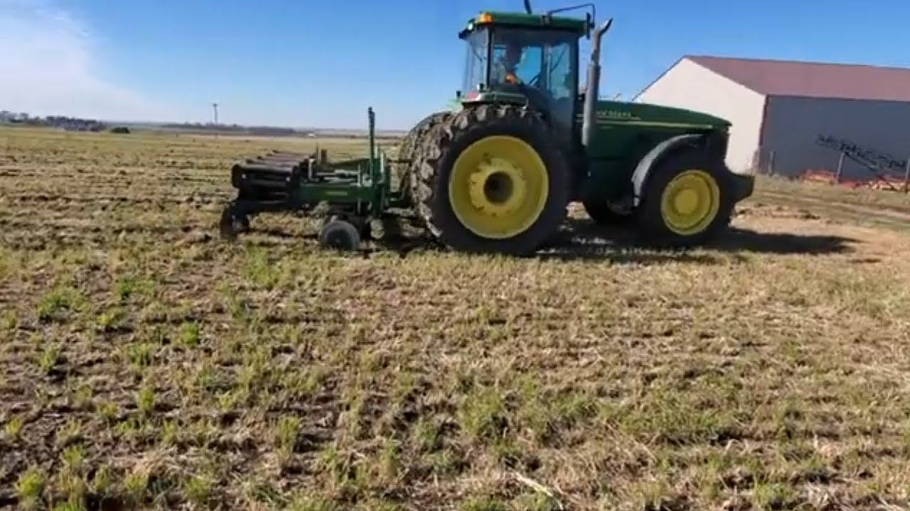 John Deere 8410 busting up soil compaction 16 inches below the ground ...