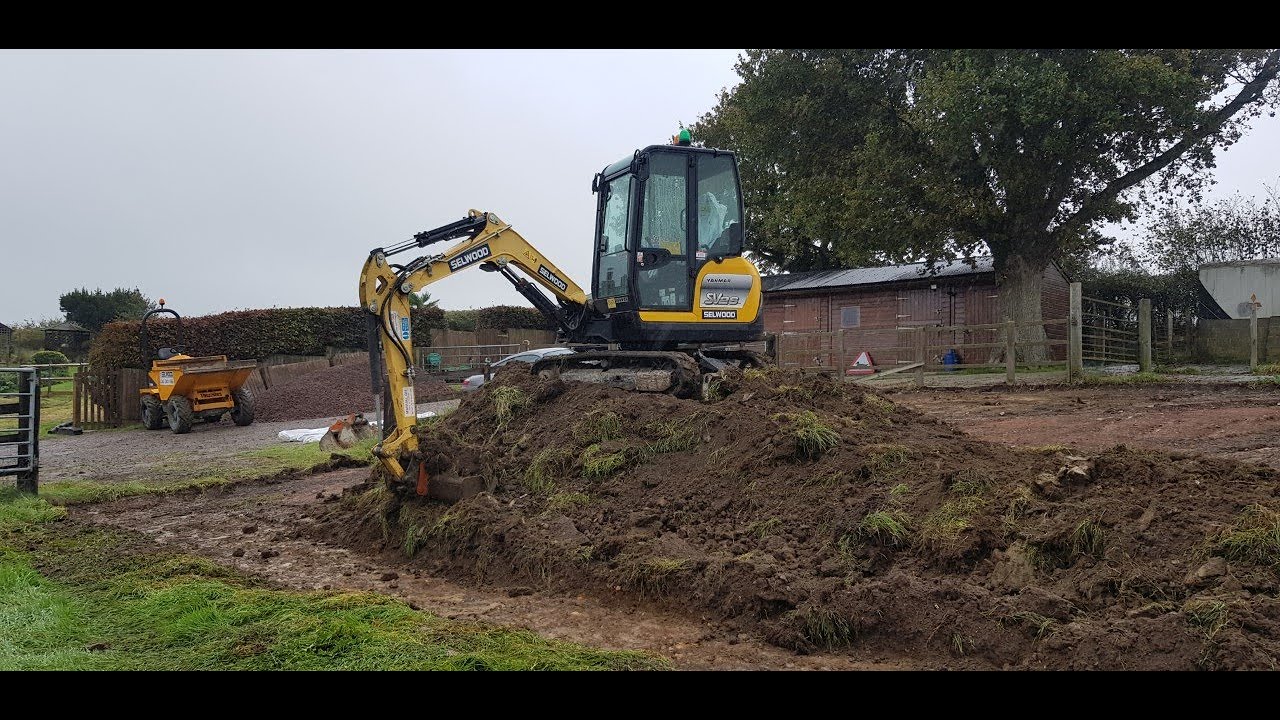 Digging out a car park with a Yanmar SV26 Mini digger and a Thwaites 3 ...