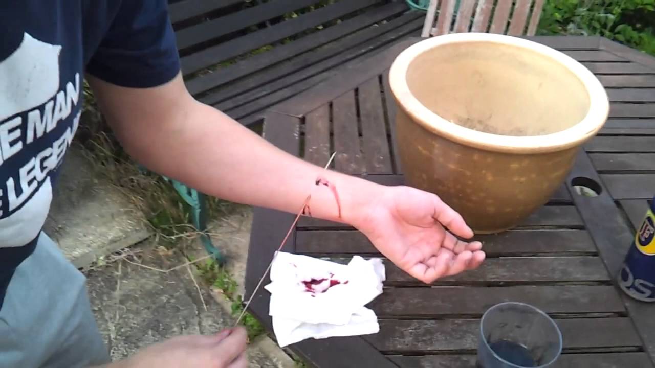Needle through arm magic - YouTube