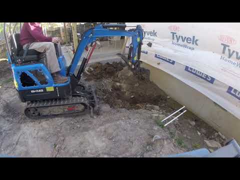 Groundhog mini excavator digging water line trench. - YouTube