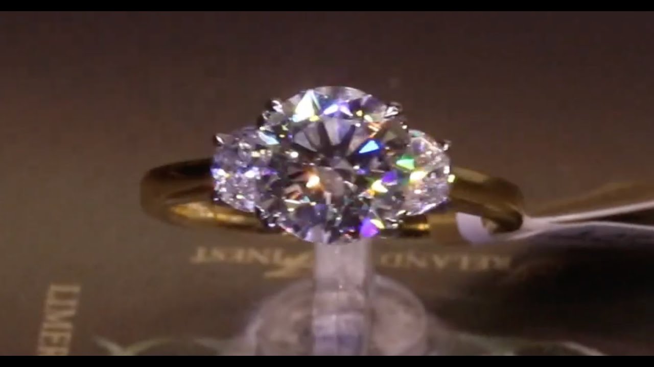 #94752 | T2.40ct/C2.05ct | Round Brilliant Centre and Two Half Moon ...