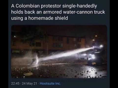 Colombian protestor single handedly holds back an armored water-cannon ...