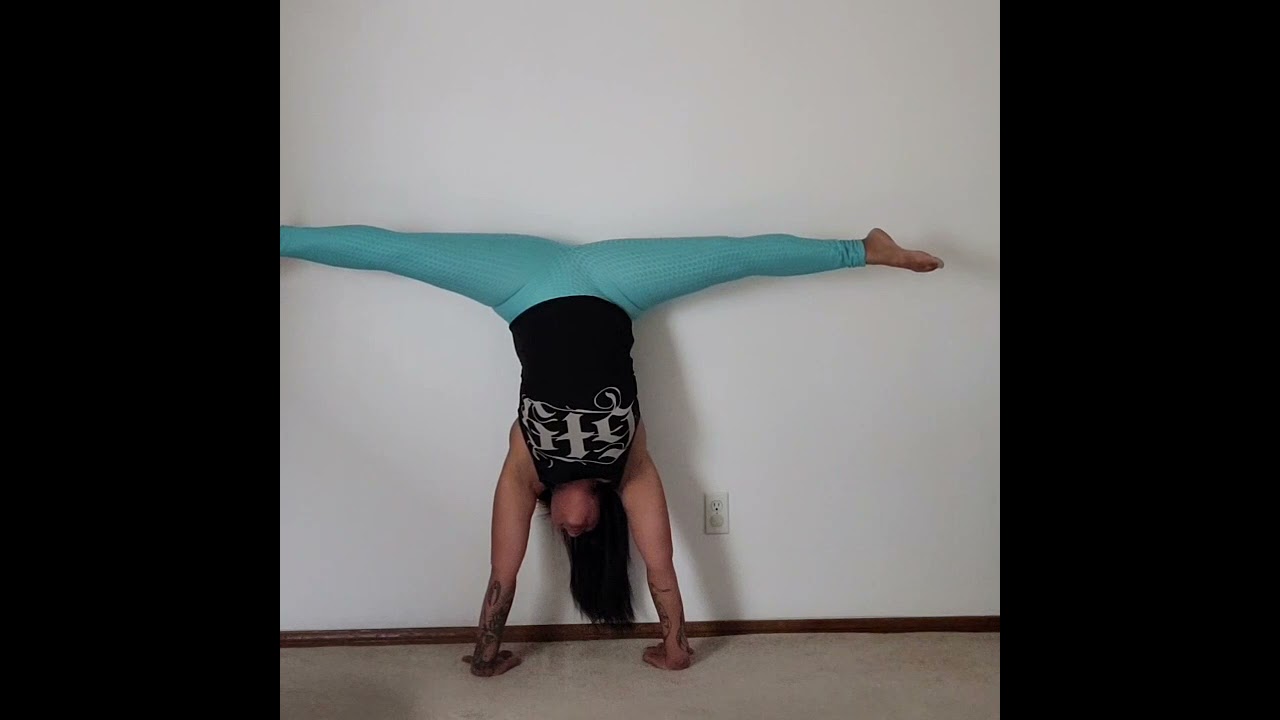 Practicing slow raises and descends. Handstand splits and Contortion ...