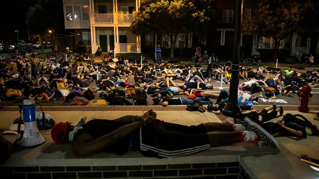 Car almost drives through protesters laying in Durham, NC street - YouTube