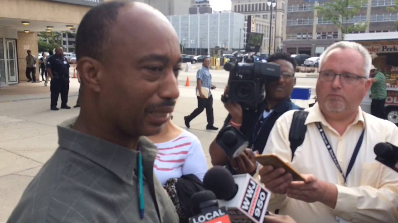 Alleged Cop Killer's "stepfather" talks outside courthouse - YouTube