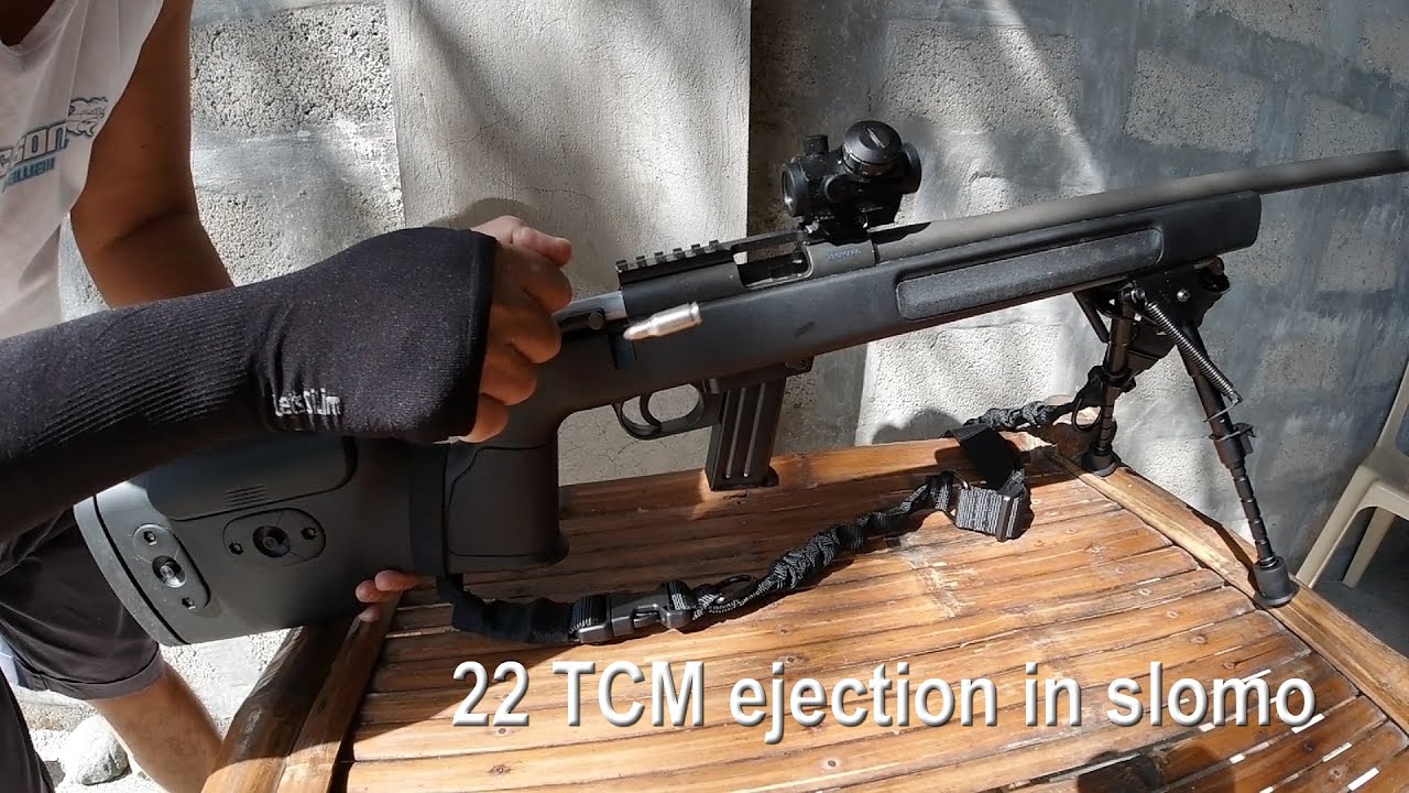 Cycling the bolt of the 22 TCM Tactical Rifle in slow motion - YouTube