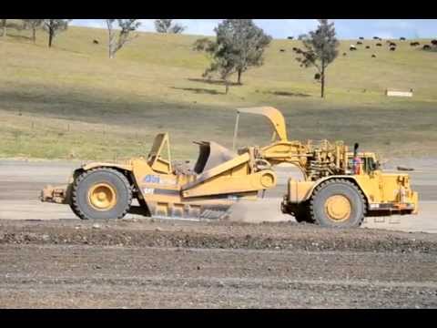 CAT 651E's Scrapers in the fill - YouTube