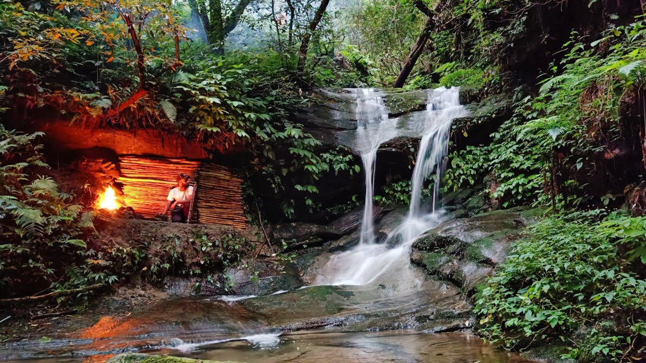 Near a waterfall in the forest. Made a secret survival shelter with the ...