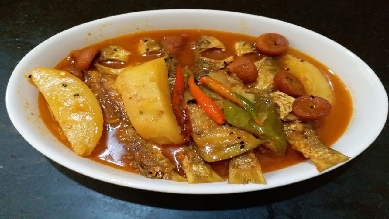 Aloo, begun, bori diye bata mach or bata fish with potato, brinjal and ...