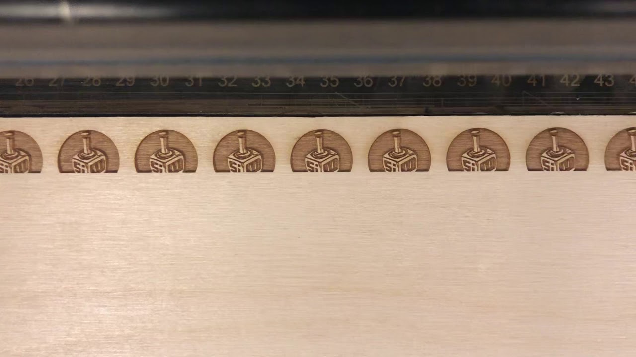Making a row of coins on a laser cutter (unedited) - YouTube