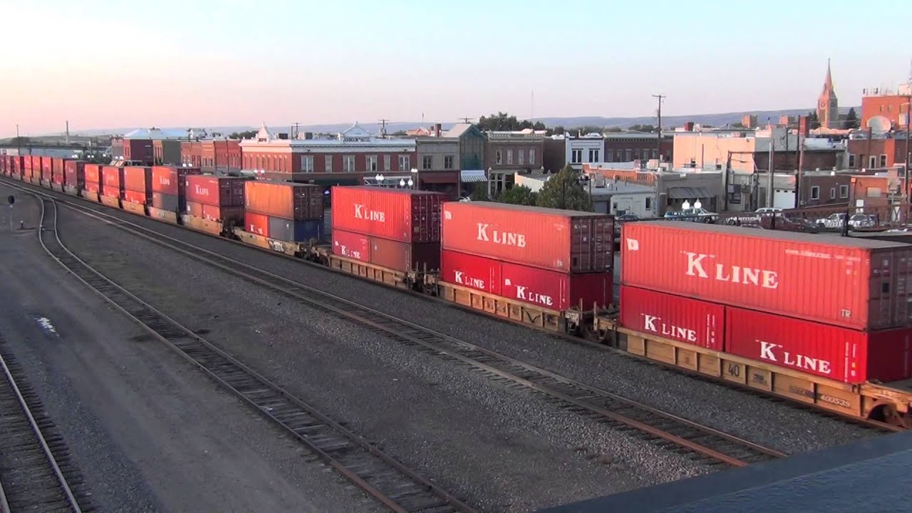 UP #8024 & CSX ES40DC's #5446 5207 depart Laramie, with K Line stack ...