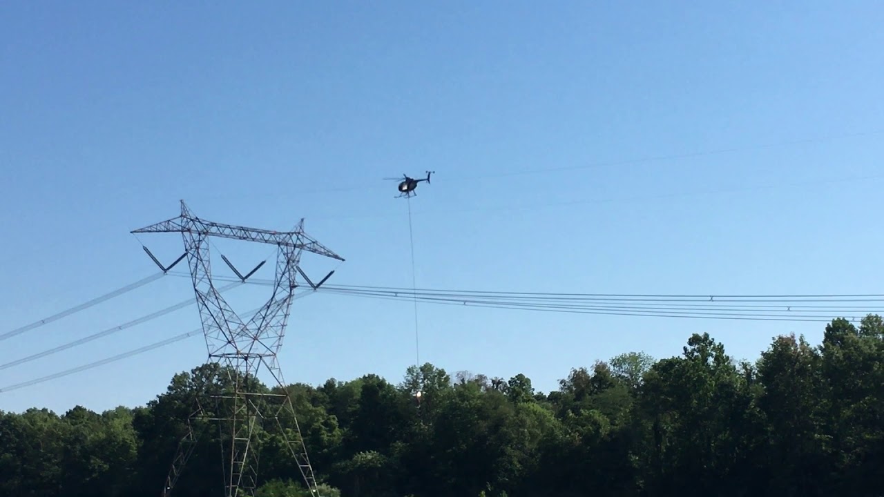 Trimming trees with a helicopter - YouTube