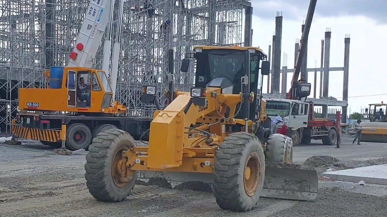Motor Grader & Roller Spreading gravel mix rock to make foundation road ...