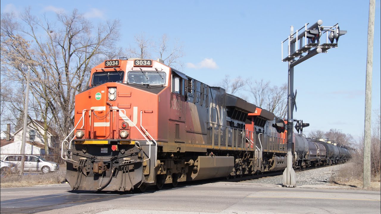 CN #s 3034 & 3084 (ET44AC), & 2970 (ES44AC) lead CN M383 south through ...