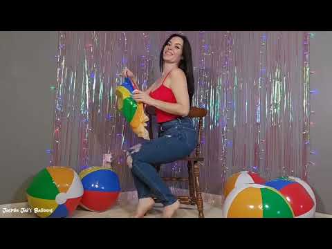Beachballs sit popped on chair #beachball #pop #popballoons 