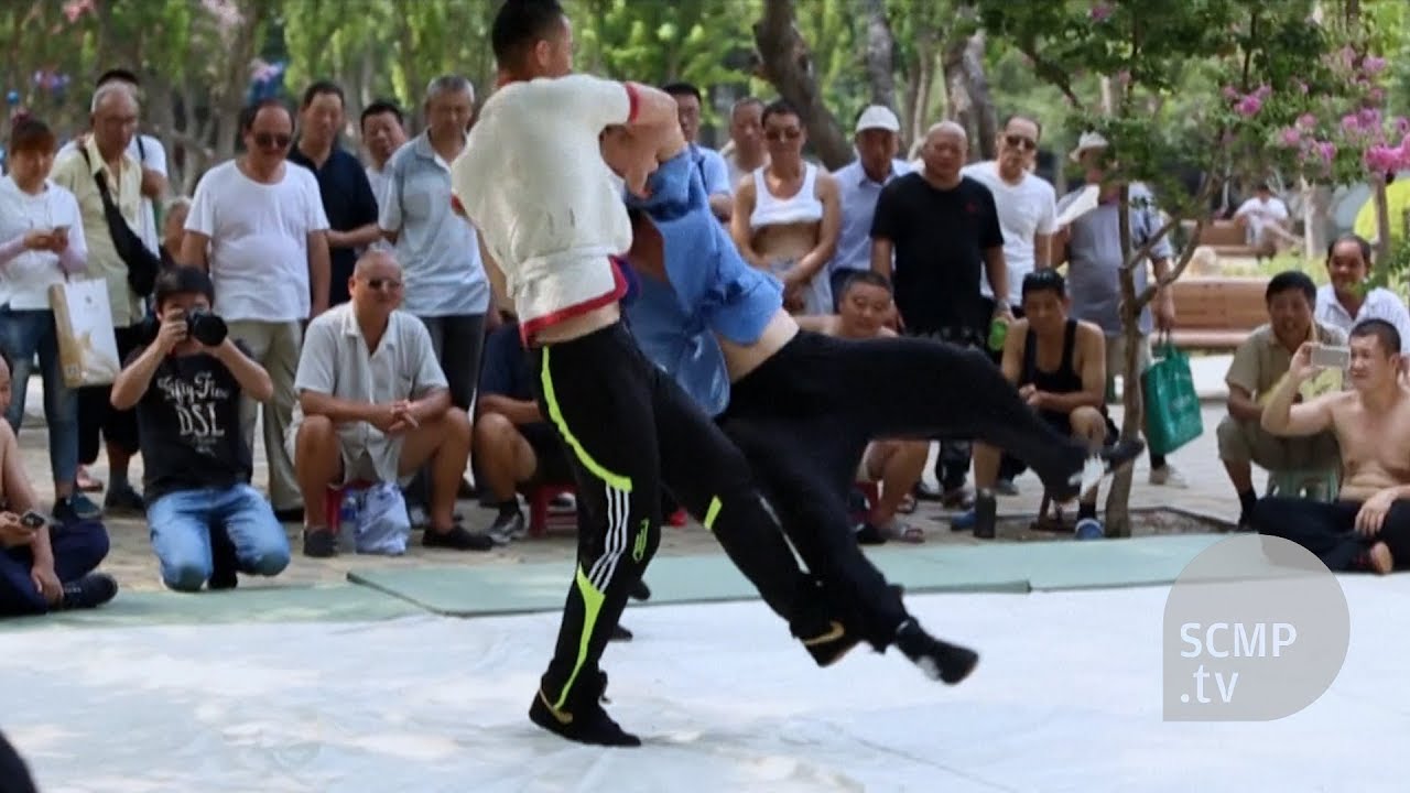 Chinese-style wrestling becomes new method of relieving stress - YouTube