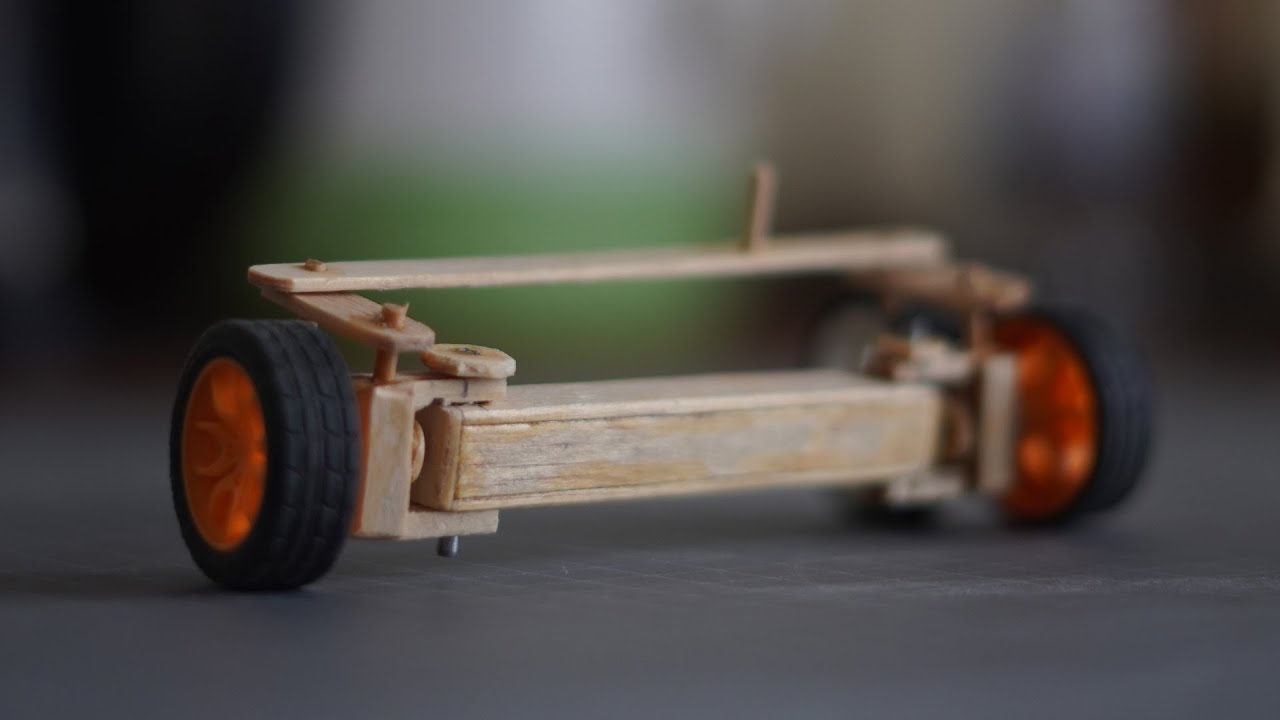 Making a front suspension with steering for car from ice cream sticks ...