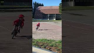 Boy rides bike in circle around tennis court then hits a bump and falls ...